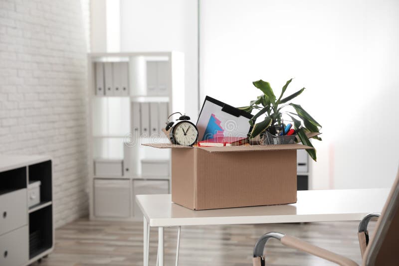 Cardboard Box Full of Stuff on Table Stock Photo - Image of layoff ...