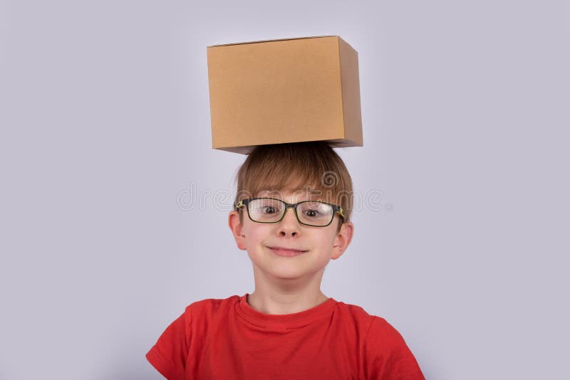 Cardboard Box on Head of Boy. Child Holding Box on His Head Stock Photo ...