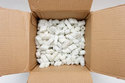 A Cardboard Box with Packing Foam Pellets Stock Photo - Image of cross ...