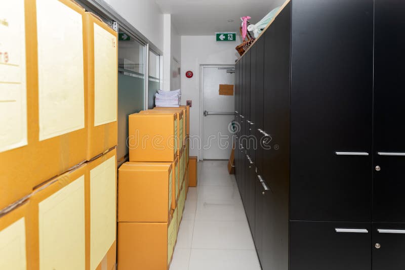 Cardboard Box with Products and File Cabinet in the Warehouse Stock ...