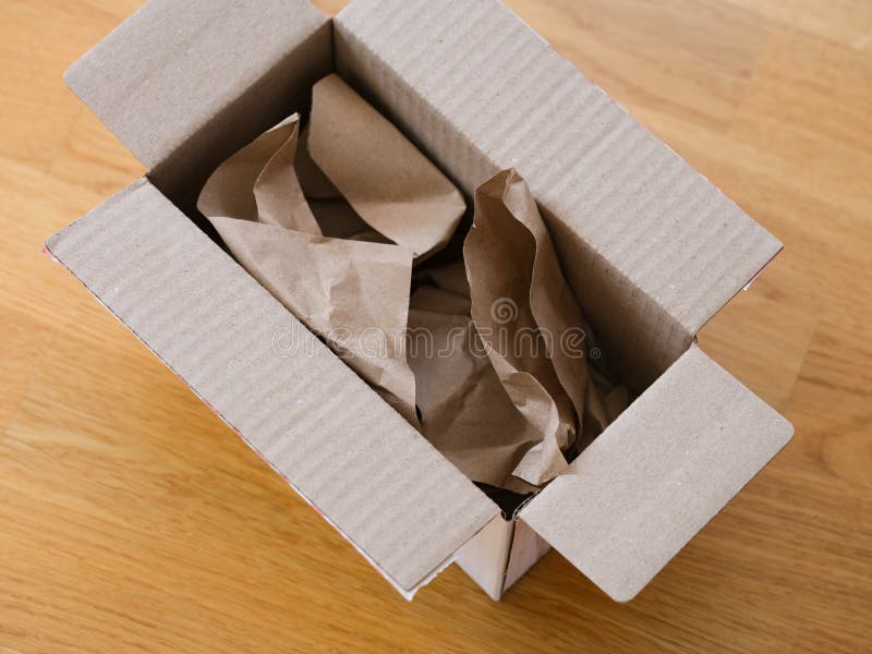 A Cardboard Box with Some Paper Inside Stock Image - Image of open ...