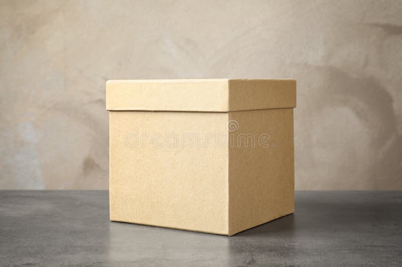 Cardboard box on table stock photo. Image of design - 109523442