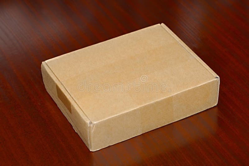 Cardboard Box on a Table stock image. Image of parcell - 92817225