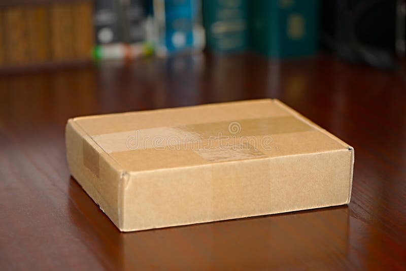 Cardboard Box on a Table stock image. Image of cargo - 93827725