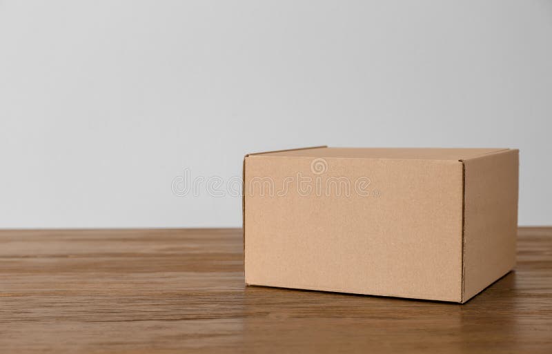 Cardboard box on table stock image. Image of transfer - 114999313