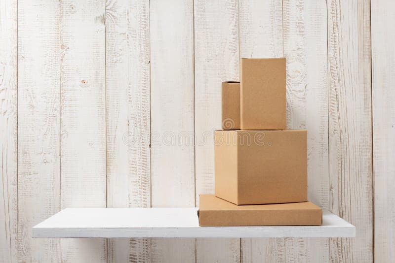 Cardboard Box on Wooden Shelf Stock Photo - Image of package, pack ...