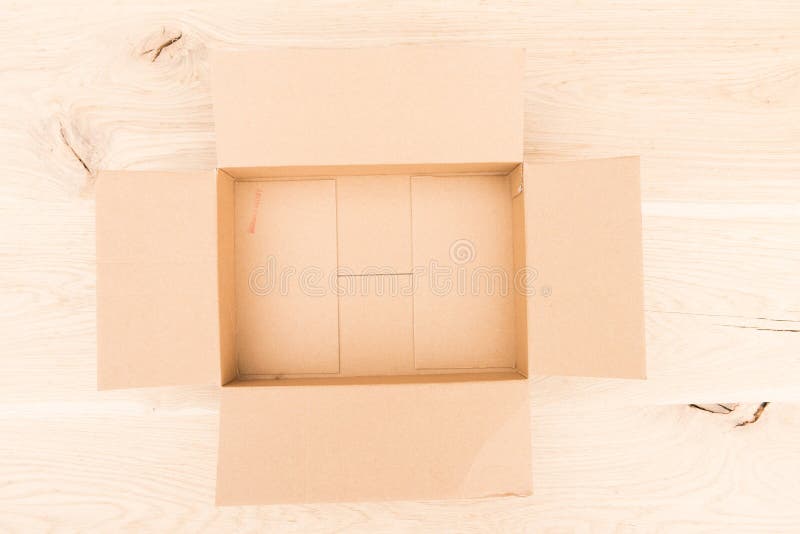 Cardboard Box on a Wooden Board Stock Photo - Image of crate, isolated ...
