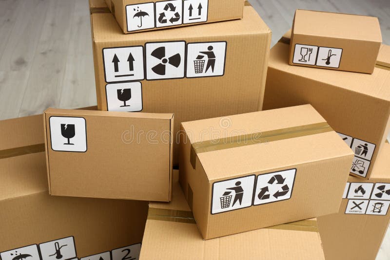 Cardboard Boxes with Different Packaging Symbols. Parcel Delivery Stock ...
