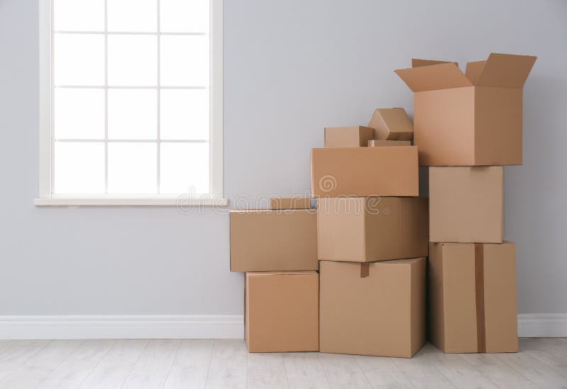 Cardboard boxes on floor stock photo. Image of office - 114376004