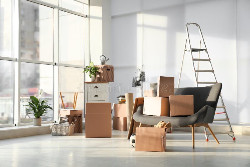 Cardboard Boxes and Household Stuff in Room. Moving Day Stock Image ...