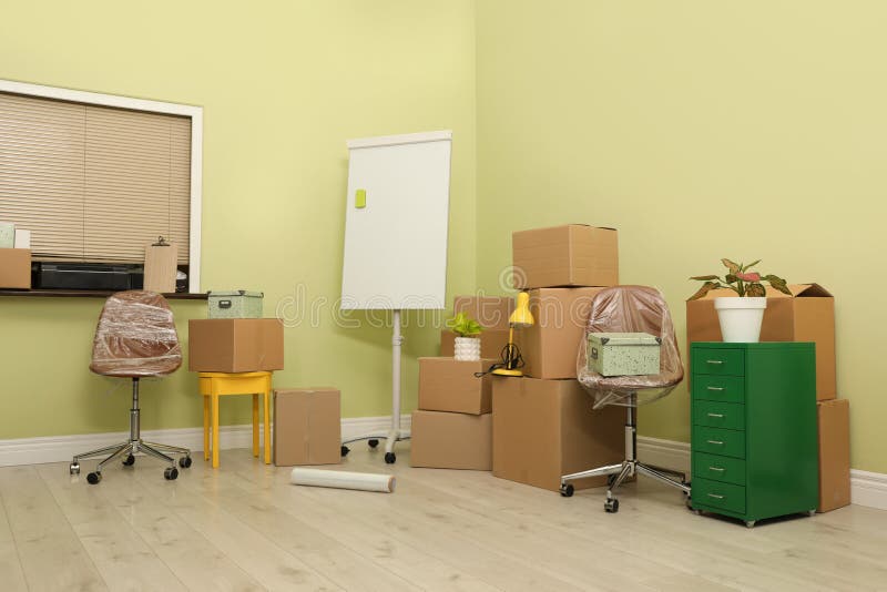 Cardboard Boxes with Packed Stuff in Office. Moving Day Stock Photo ...