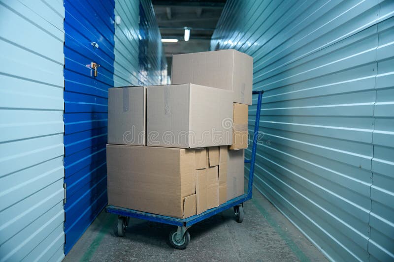 Cardboard Boxes Stuffed with Things on a Cart Stock Photo - Image of ...