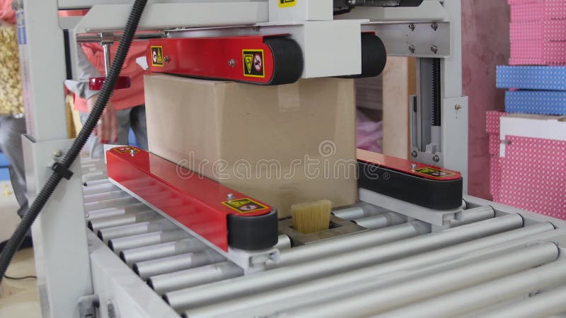 Cardboard Boxes are Weighed on a Transporter of a Packaging Line Stock ...