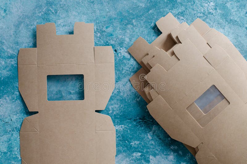 Cardboard Boxes with Window on Hand Painted Aqua Background. Top View ...