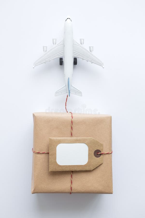 Cardboard Delivery Box with Copy Space Label and Small Airplane ...