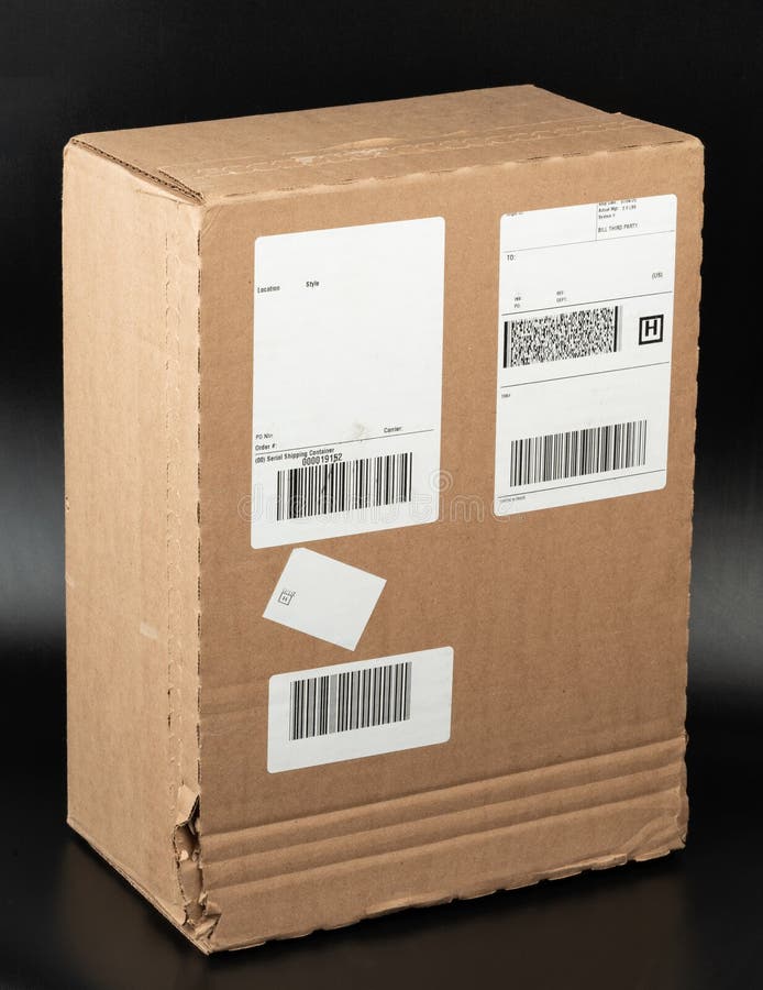 Delivery Box Placed on Dark Surface with Shipping Labels Attached Stock ...