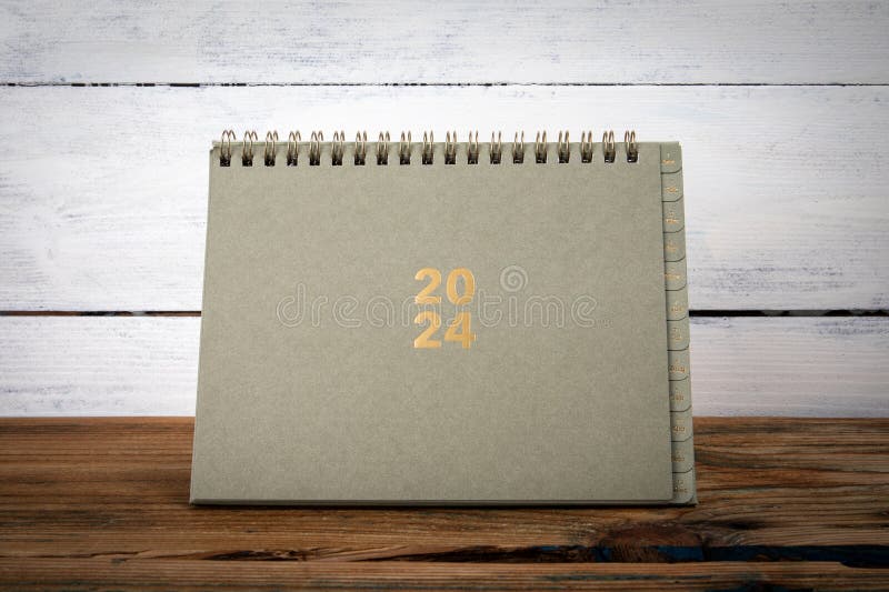 2024 Cardboard Desk Calendar and Planner on a Wooden Texture Table ...