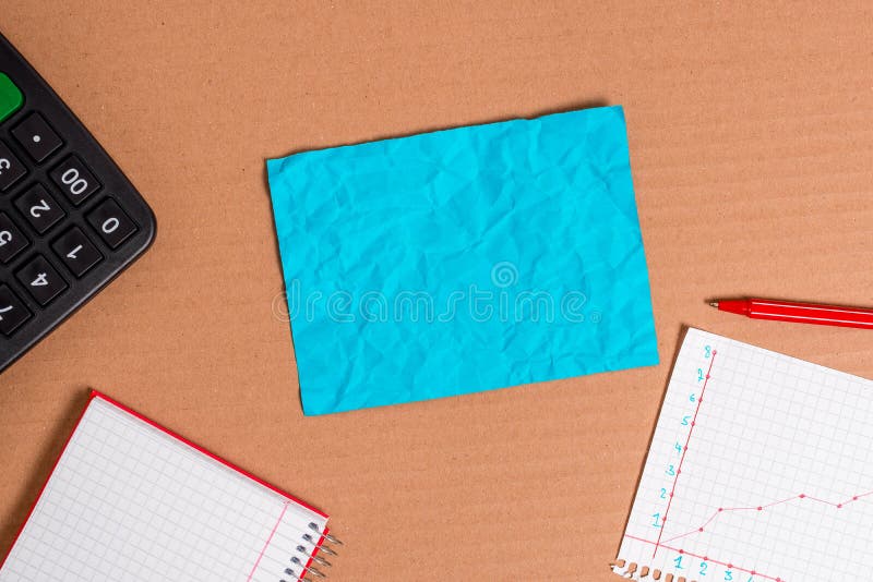 Cardboard Desk with Notebook Paper and Office Appliances. Paperboard ...