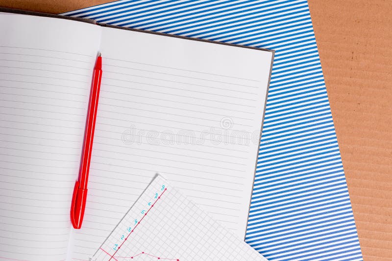 Cardboard Desk with a Striped Blue Sheet, Notebook Paper and Office ...