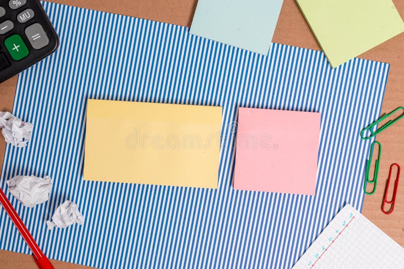 Cardboard Desk with a Striped Blue Sheet, Notebook Paper and Office ...