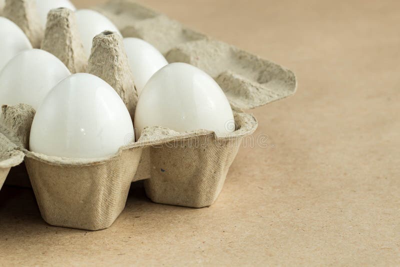 Cardboard Egg Rack with Eggs on Rustic Background with Copy Space Stock ...