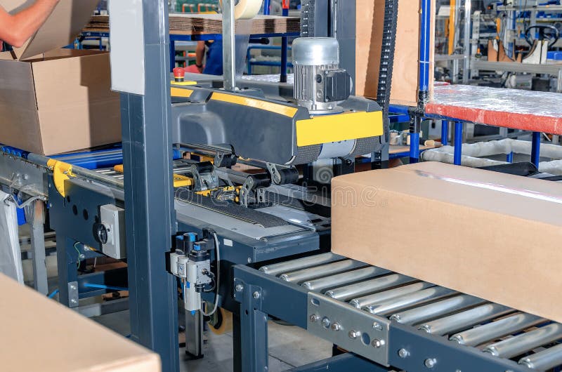 Cardboard Packaging Machine. Production Line of Packaging Stock Photo ...