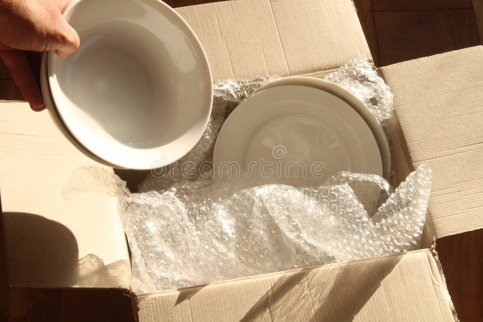 Cardboard Packing Box, Plates and Bubble Wrap Stock Image - Image of ...