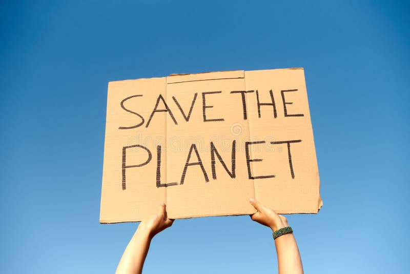 Cardboard Sign Saying Save the Planet Held by Two Hands on a Clear Sky ...