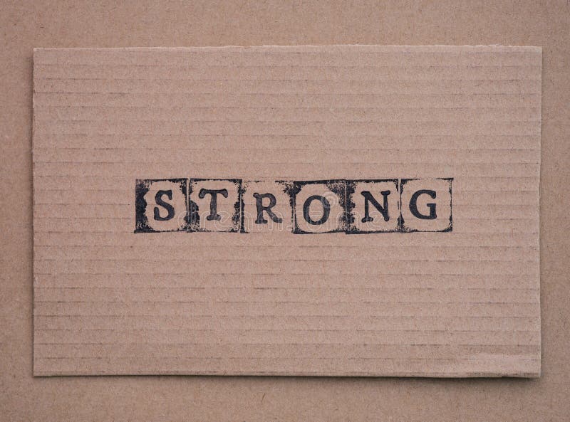 Cardboard with word Strong stock photo. Image of carton - 237336804
