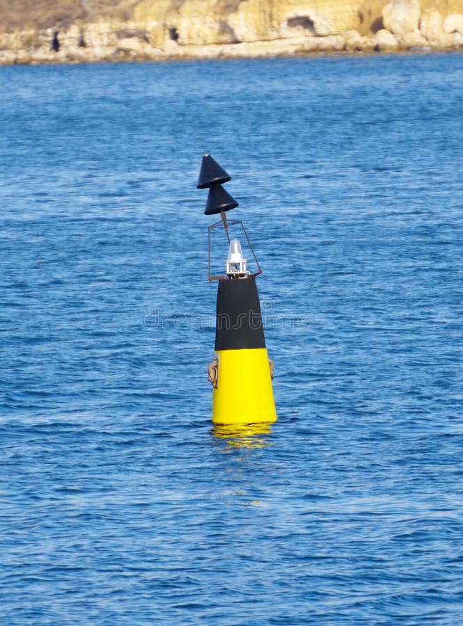 Cardinal markings on a sea stock image. Image of buoy - 167427263