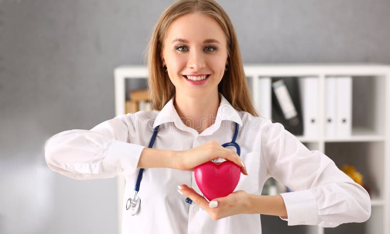 Cardiologist Doctor Holding And Reading An Ecg Paper Report Of Patient