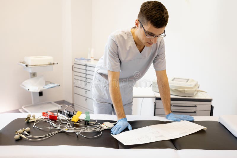 Cardiologist Reading Cardiogram Stock Photo - Image of cardiology ...