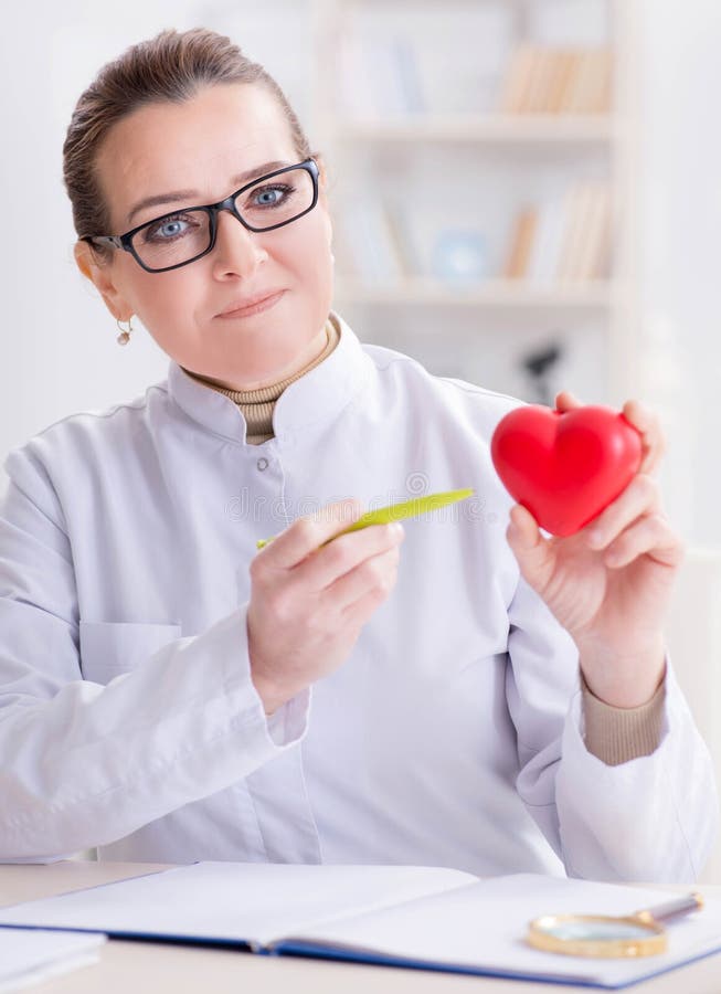 Cardiologist with Red Heart in Medical Concept Stock Photo - Image of ...