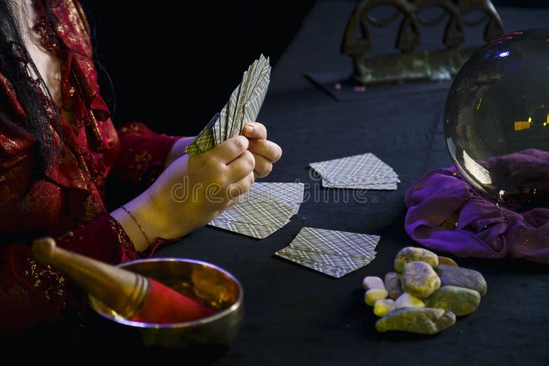 Cards in the Hands of a Fortune Teller in a Magic Salon on a Black ...