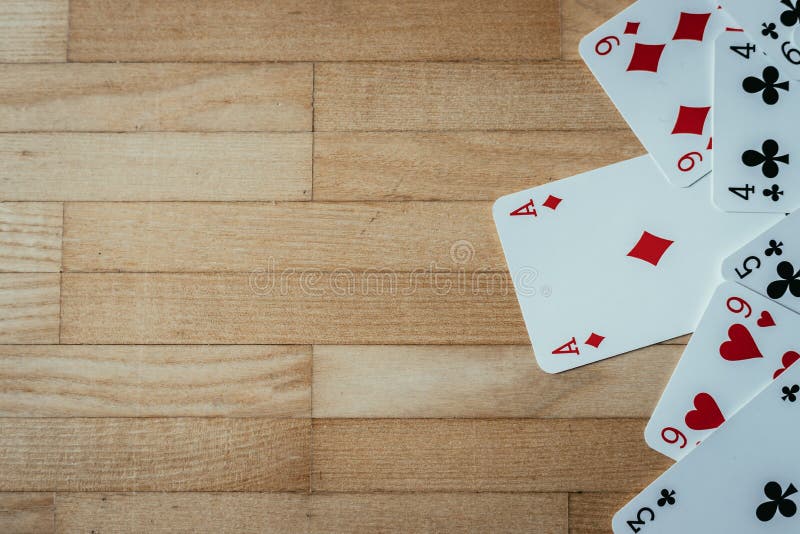 Cards Lying on Rustic Wood Table, Playing Cards. Copy Space Stock Photo ...