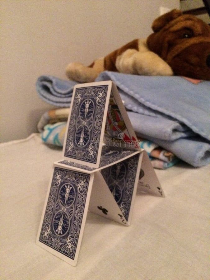 Tower of cards with hammer stock image. Image of cards - 5499643