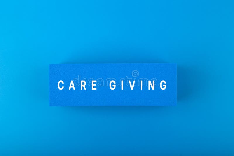 Care Giving Text Written on Blue Rectangular Against Blue Background ...
