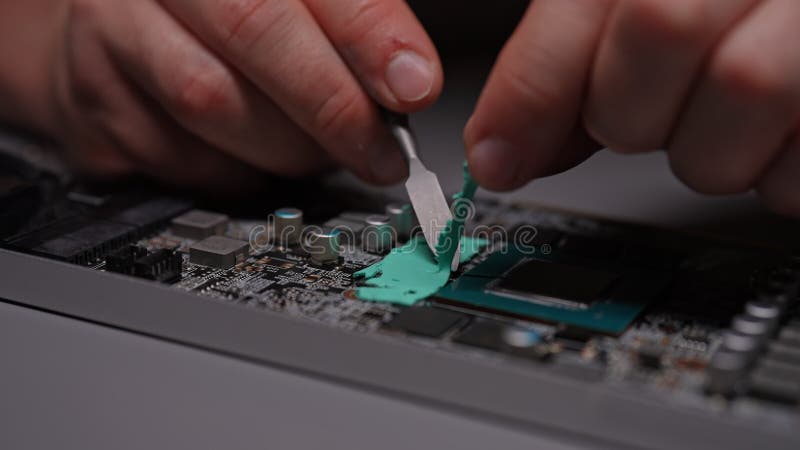 Careful Removal of Old Thermal Paste from GPU Using Metal Spatula in ...