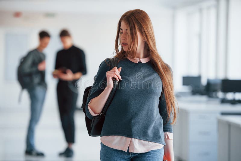Carefully Looking Back. Group of Young People Walking in the Office at ...