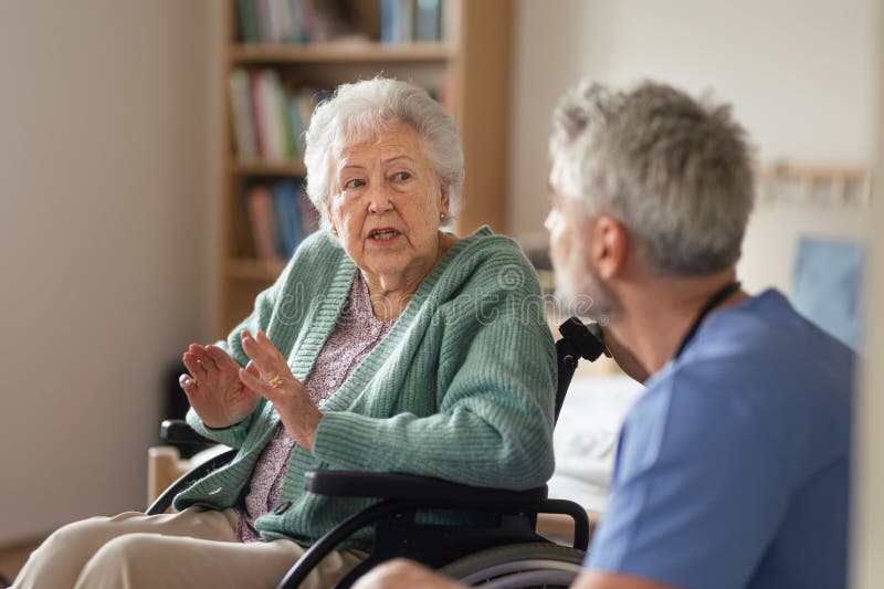 Caregiver Doing Regular Check-up of Senior Woman in Her Home. Stock ...