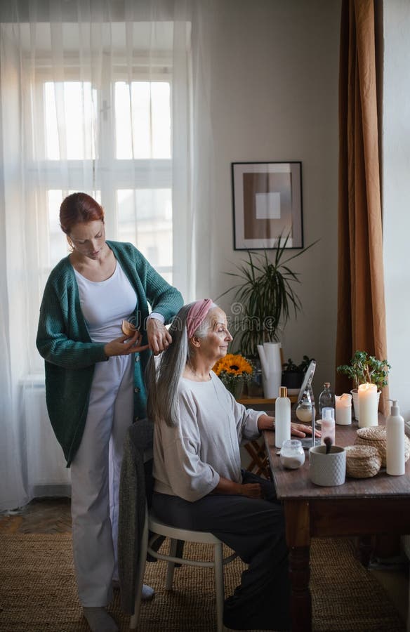 Caregiver Helping Her Client with a Hairstyle. Stock Image - Image of ...