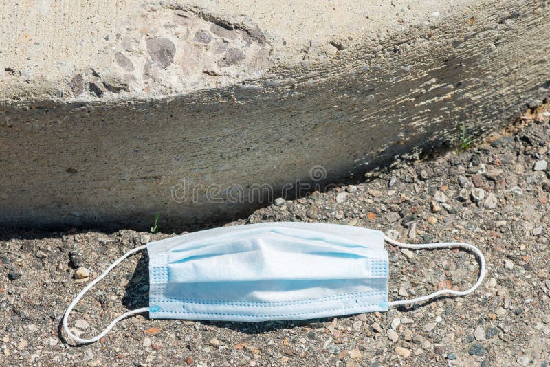 A Carelessly Discarded Mask Stock Image - Image of unsafe, hazardous ...