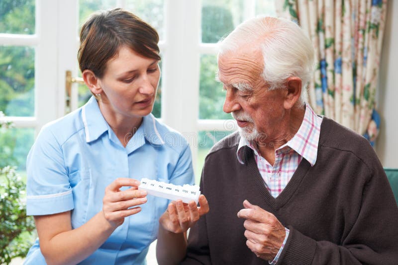 Carer Helping Senior Man with Medication Stock Image - Image of drug ...