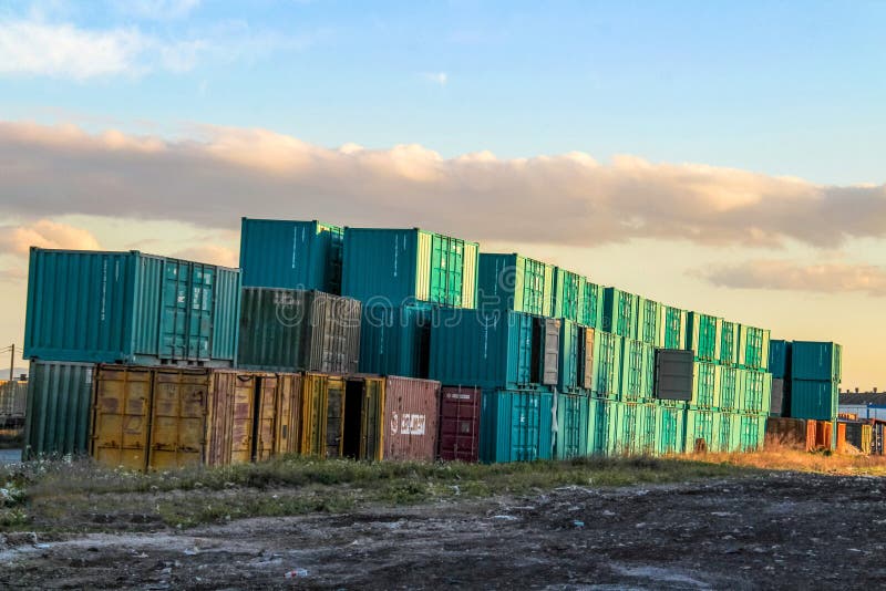 Cargo Container Handling in a Shipyard with Heavy Machinery Stock Photo ...