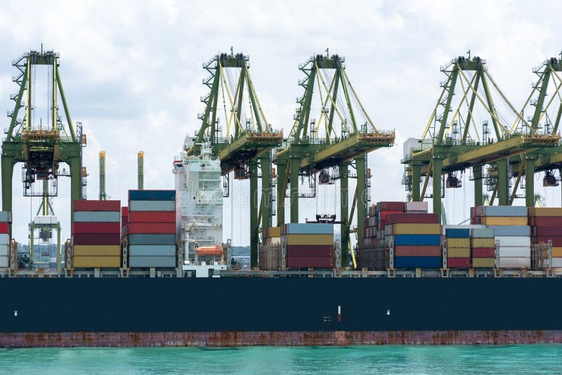 Cargo Container Ship Berthed Under Gantry Cranes. Stock Photo - Image ...