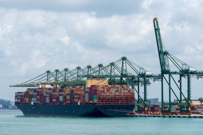 Cargo Container Ship Berthed Under Gantry Cranes. Stock Photo - Image ...