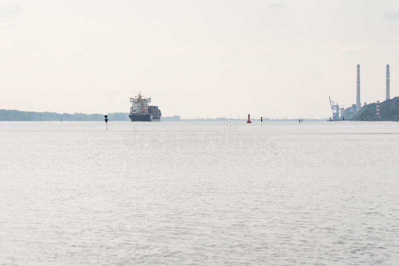 Cargo Container Ship Departing from the Port To the Sea in the Mist ...