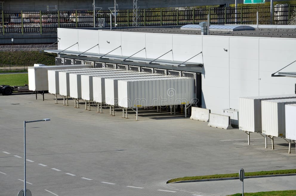 Cargo Containers Standing on Gates in Logistics Center Stock Photo ...