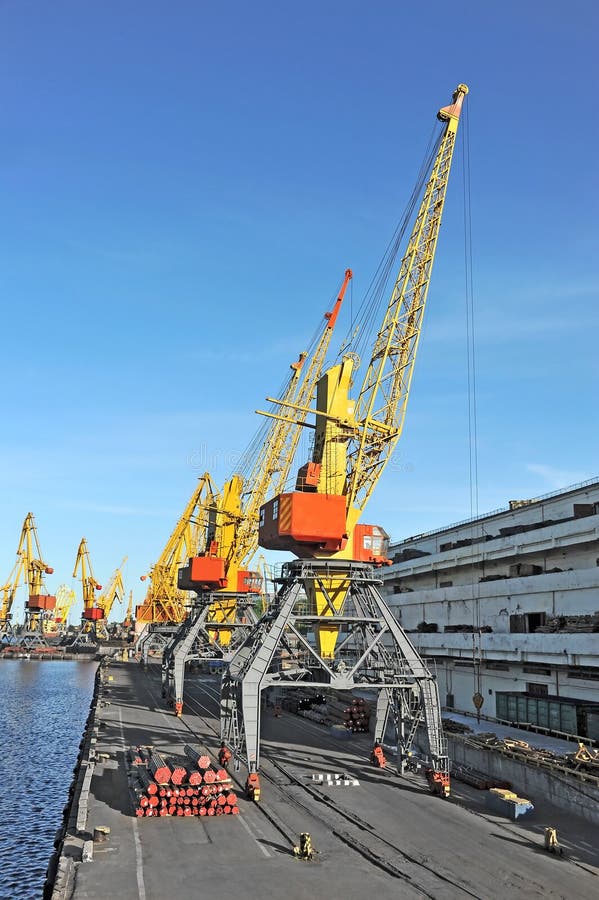 Cargo crane and pipe stack stock photo. Image of port - 32672218