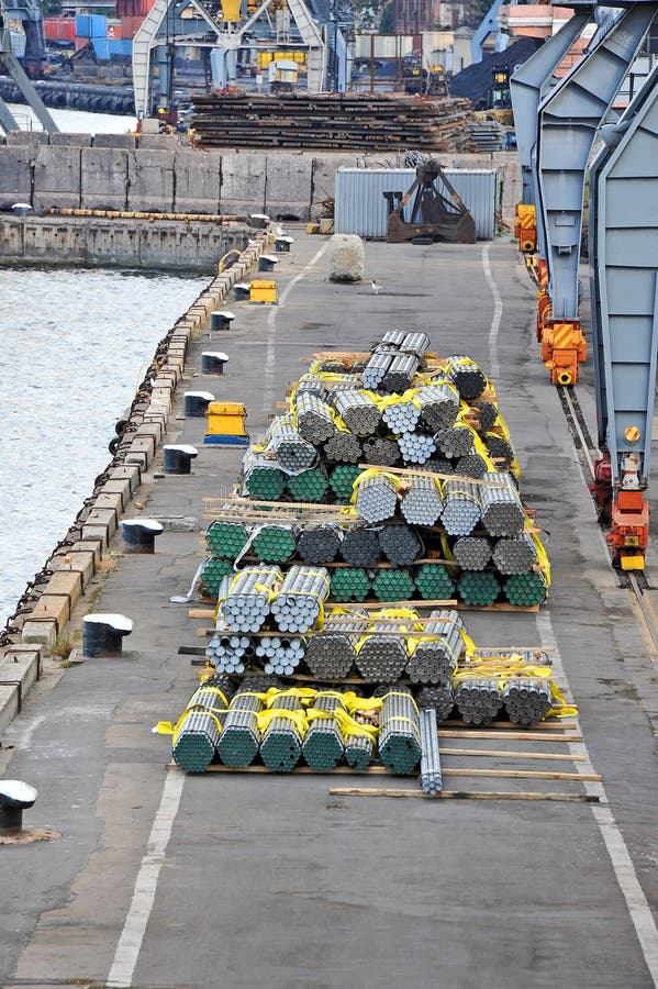 Cargo crane and pipe stack stock image. Image of quayside - 37907609